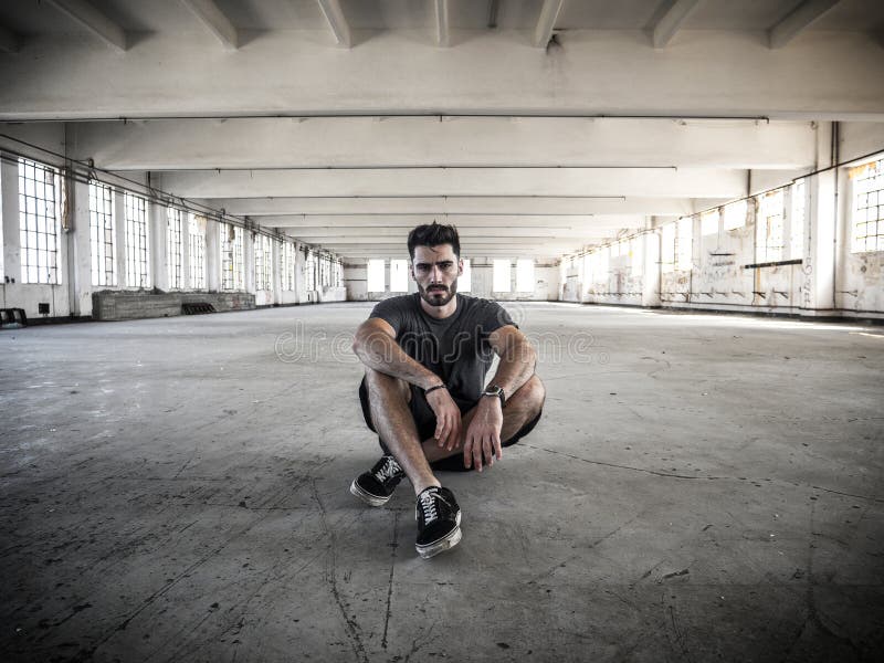 Handsome Young Man in Empty Warehouse Stock Photo - Image of good ...