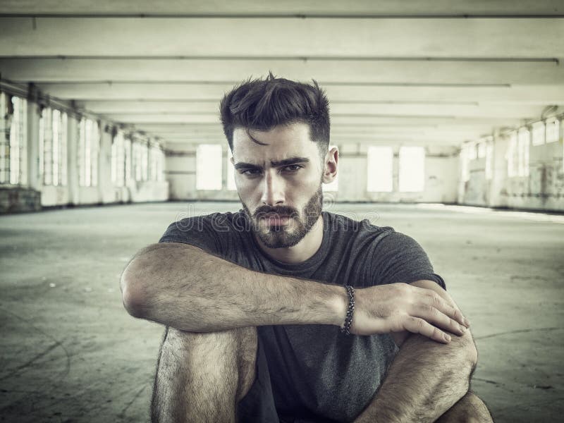 Handsome Young Man in Empty Warehouse Stock Photo - Image of ...