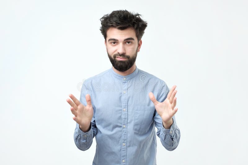 Handsome Young Man Explaining Something and Gesturing with His Hands ...