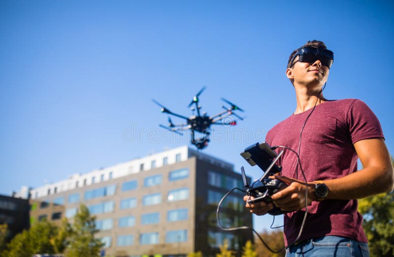 Handsome Young Man Flying a Drone Outdoors Stock Image - Image of ...