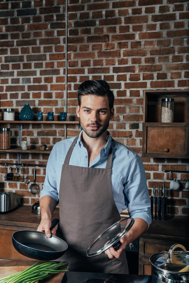 Young Man with Frying Pan and Spatula, Isolated Stock Photo - Image of ...