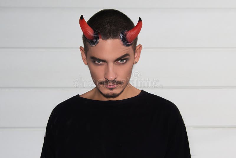 Handsome Young Man with Halloween Horns on His Head Stock Photo - Image ...
