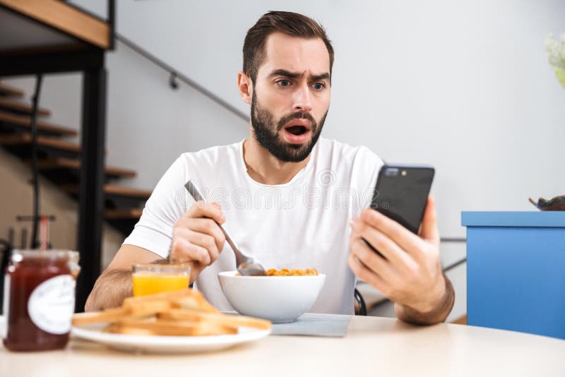 Handsome Young Man Having Breakfast Stock Image - Image of computer ...
