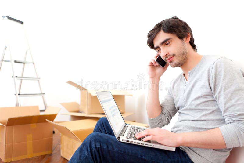 Handsome Young Man in His New Flat Ordering on His Laptop Stock Image ...
