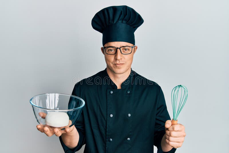 Handsome Young Man Holding Bread Dough and Blender Relaxed with Serious ...