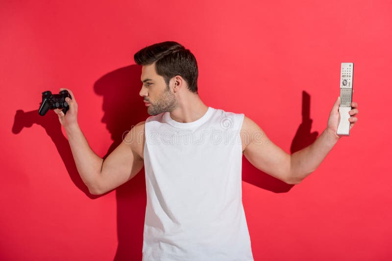 Handsome Young Man Holding Gamepad and Remote Controller Stock Photo ...