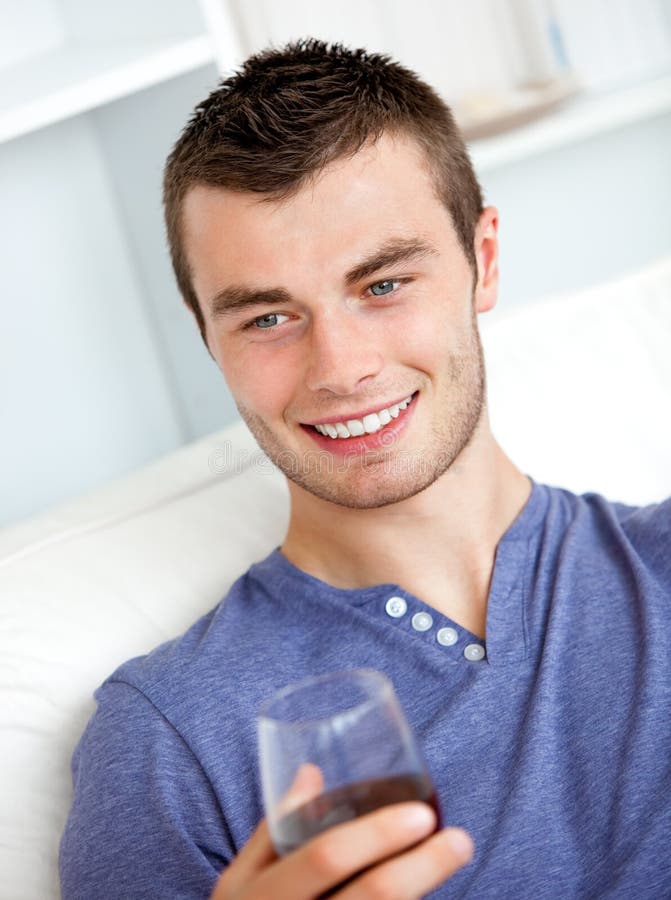 Handsome Young Man Holding a Glass of Wine Stock Photo - Image of ...