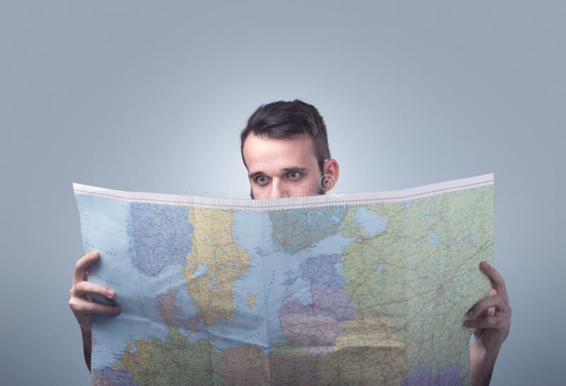 Young man holding map stock image. Image of holiday - 103045365