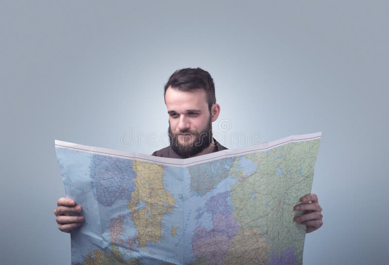 Young man holding map stock image. Image of person, foreign - 109499159