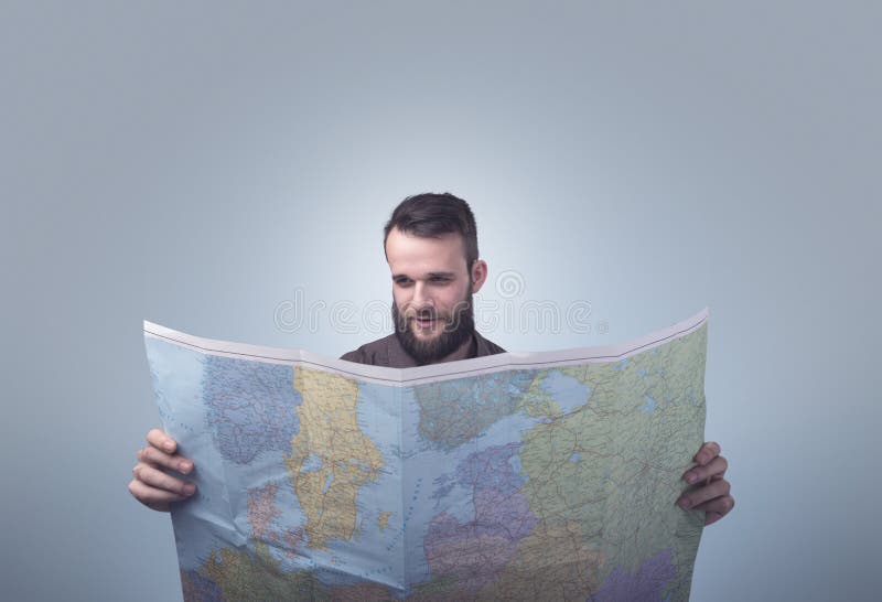Young man holding map stock image. Image of holiday - 110595731