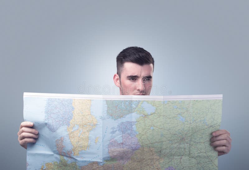 Young man holding map stock photo. Image of outlook - 113676758