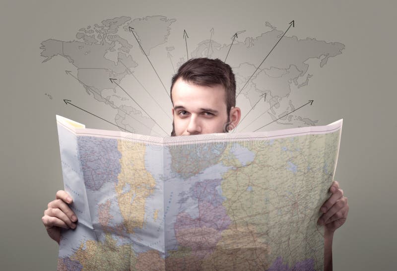 Young man holding map stock image. Image of decision - 110595681