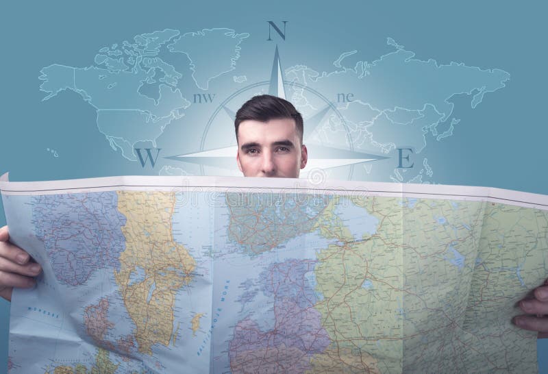 Young man holding map stock photo. Image of backpacking - 100377718