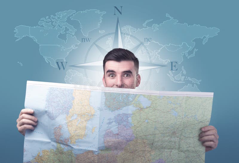 Young man holding map stock image. Image of adventure - 108500263