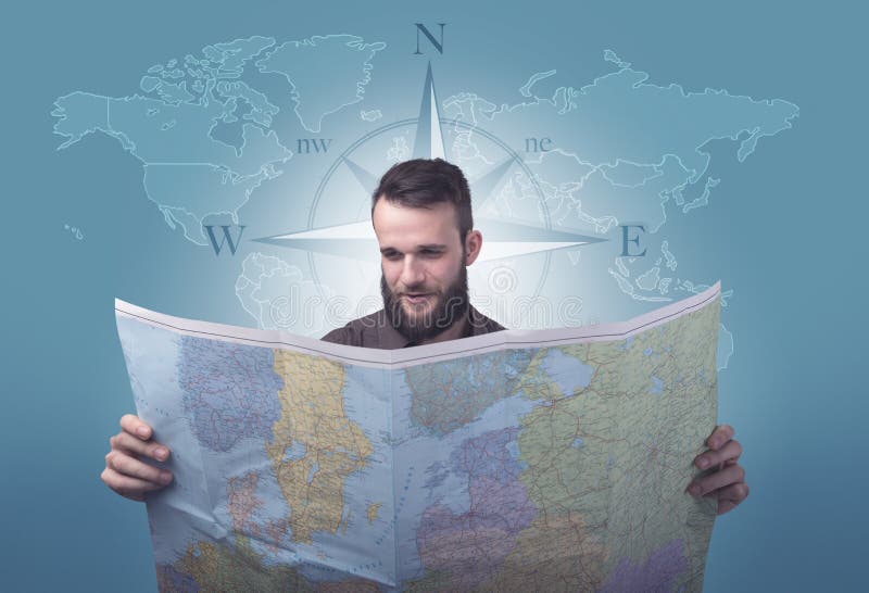 Young man holding map stock image. Image of blue, navigation - 112800813