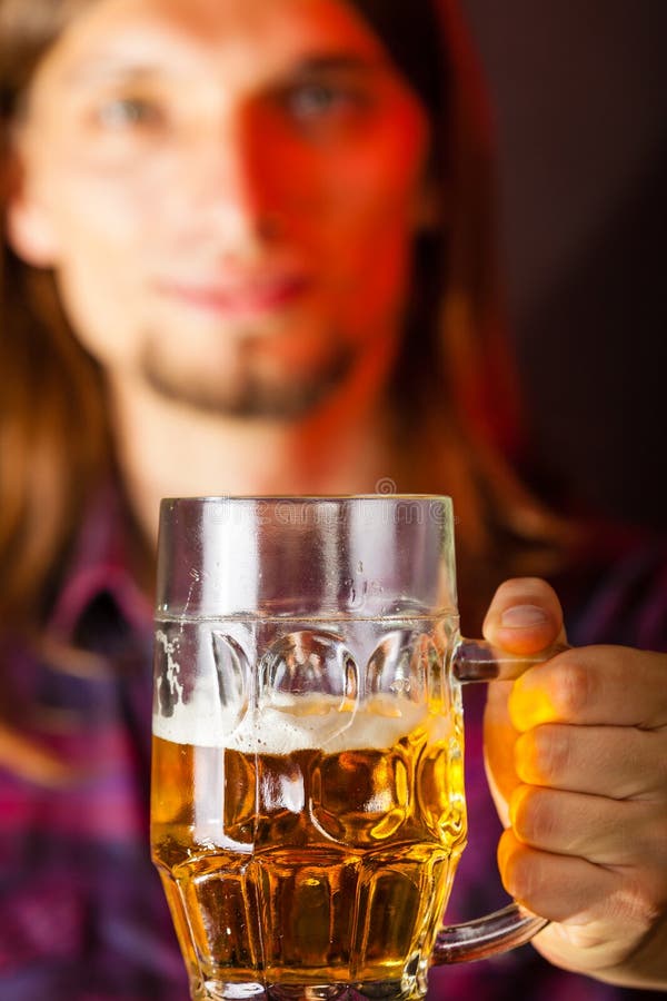 Handsome Young Man Holding a Mug of Beer Stock Photo - Image of face ...