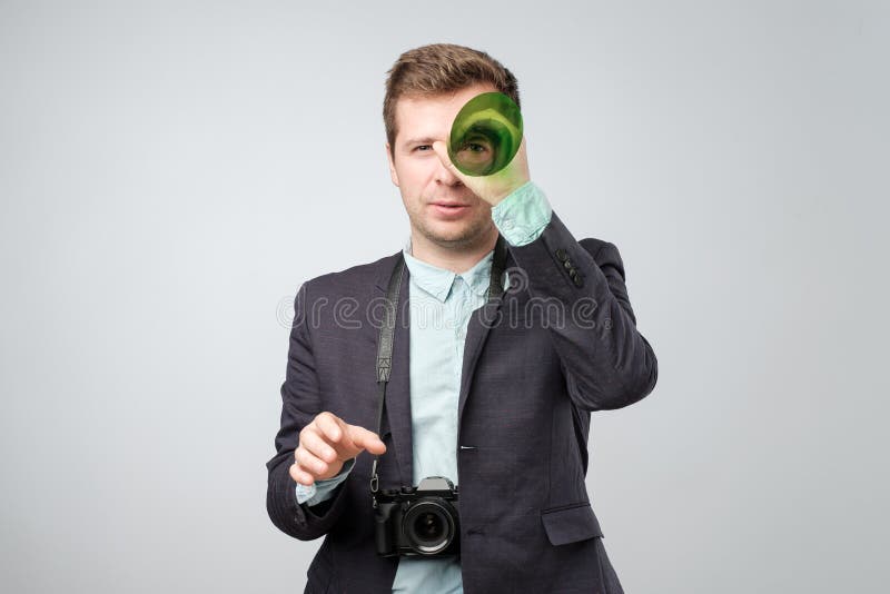 Handsome Young Man Holding a Photo Camera. Stock Photo - Image of ...