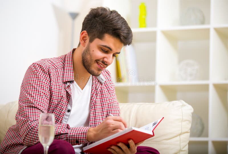 Handsome Young Man at Home Writing on Notebook, Sitting Stock Image ...