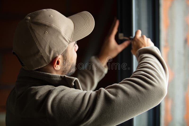 Handsome Young Man Installing Bay Window in New House Stock Photo ...