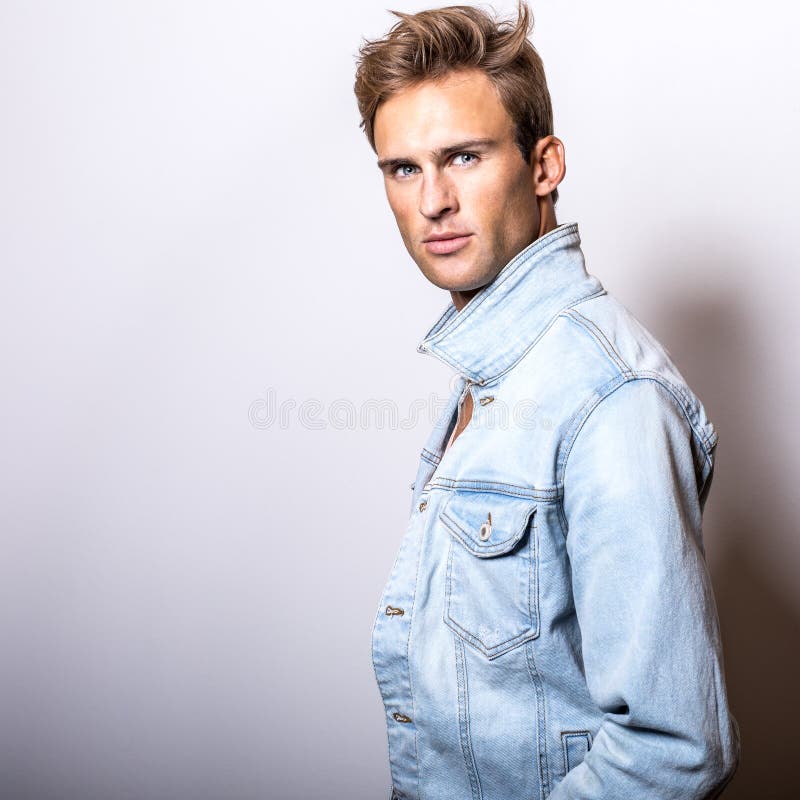 Handsome Young Man in Jeans Jacket Pose in Studio. Stock Photo - Image ...