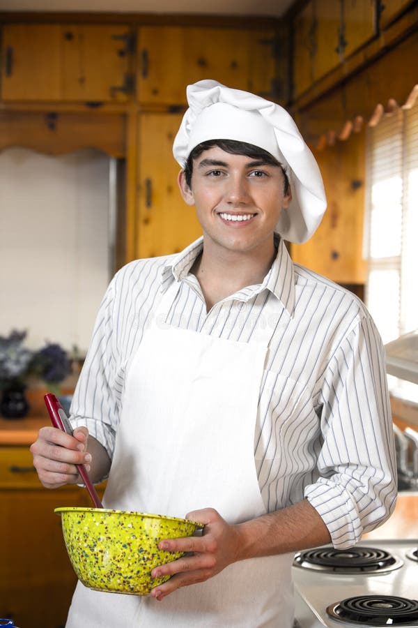 Handsome Young Man in Kitchen Stock Image - Image of looking, portrait ...