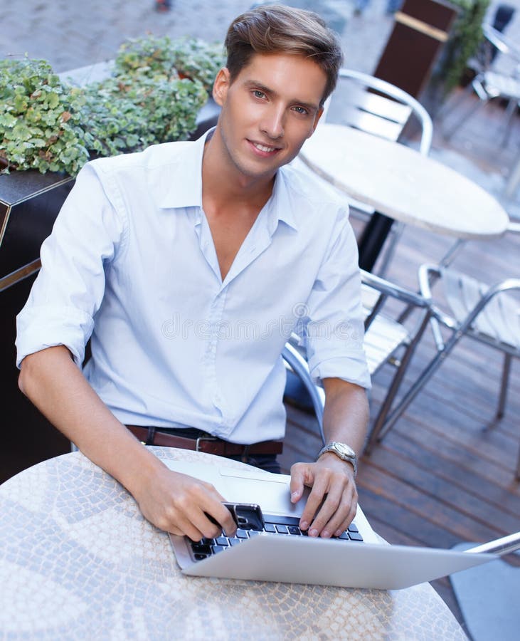 Attractive man with laptop stock photo. Image of computer - 2442520