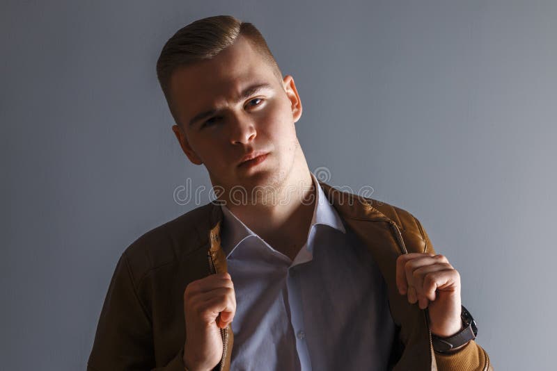 Handsome Young Man in Leather Jacket Poses Stock Photo - Image of brown ...