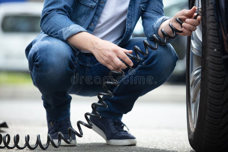 Handsome Young Man Lifting Car Stock Photo - Image of alone, lifestyle ...