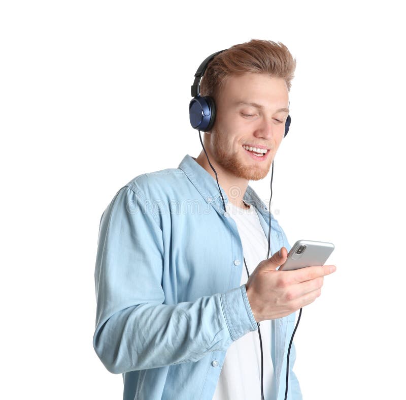 Handsome Young Man Listening To Music With Headphones On White Stock