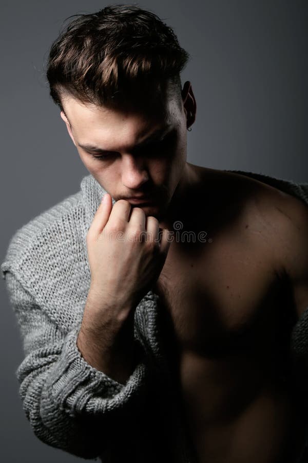 Handsome Young Man Looking at Camera. Isolated on Grey Stock Photo ...