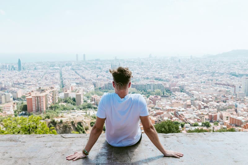 Handsome Young Man Looking at the Views Form the Top of a Mountain ...