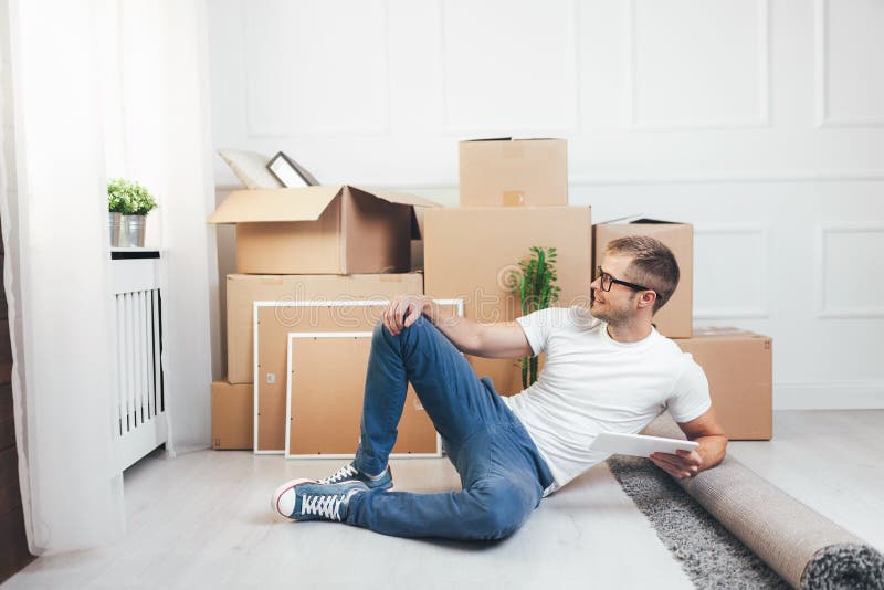 Handsome Young Man Moving To a New Home Stock Photo - Image of interior ...