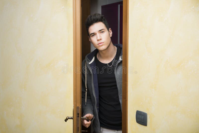 Handsome Young Man Opening Door To Enter Stock Photo - Image of person, arrive: 48648054