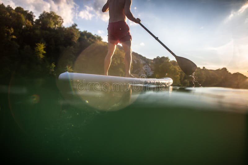 Handsome Young Man on a Paddle Board Stock Photo - Image of recreation ...