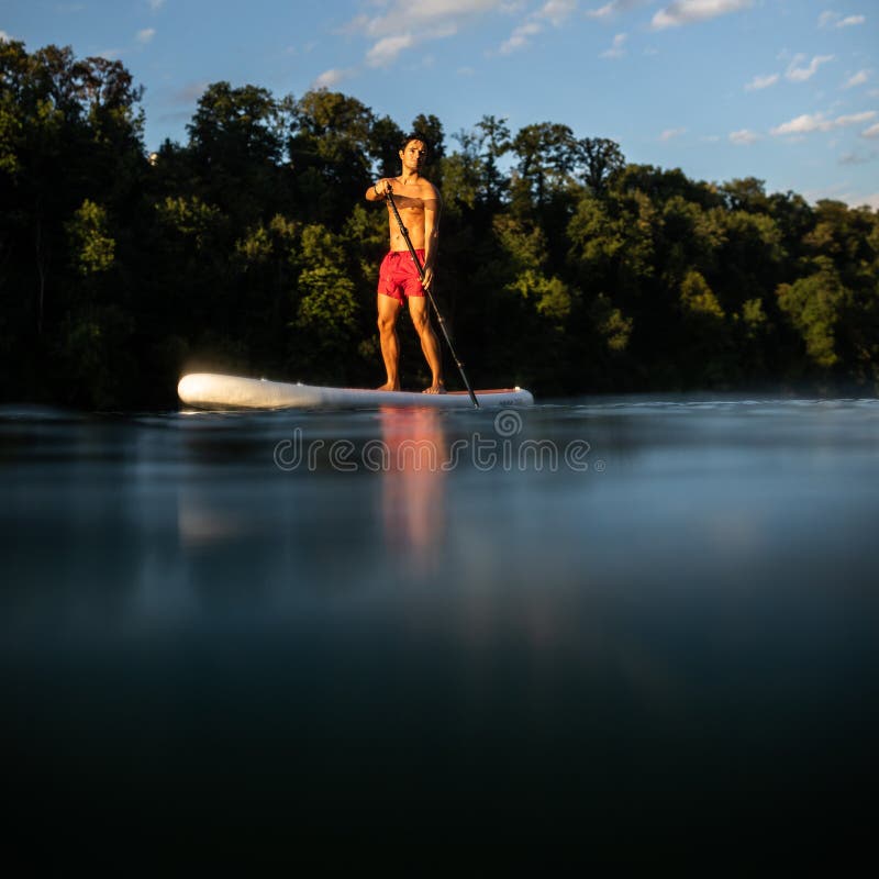 Handsome Young Man on a Paddle Board Stock Image - Image of people ...