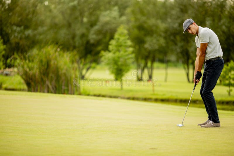 Young man playing golf stock photo. Image of blue, game - 212309566