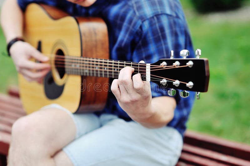 Handsome Young Man Playing Guitar Stock Photo - Image of instrument ...