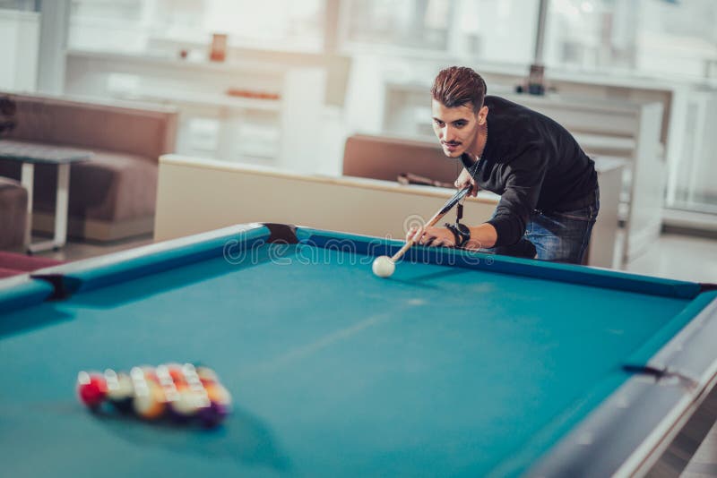 Young Man Playing Pool in Pub Stock Photo - Image of handsome, hall ...
