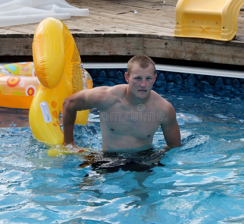 Handsome Young man in pool stock photo. Image of wood - 43152538