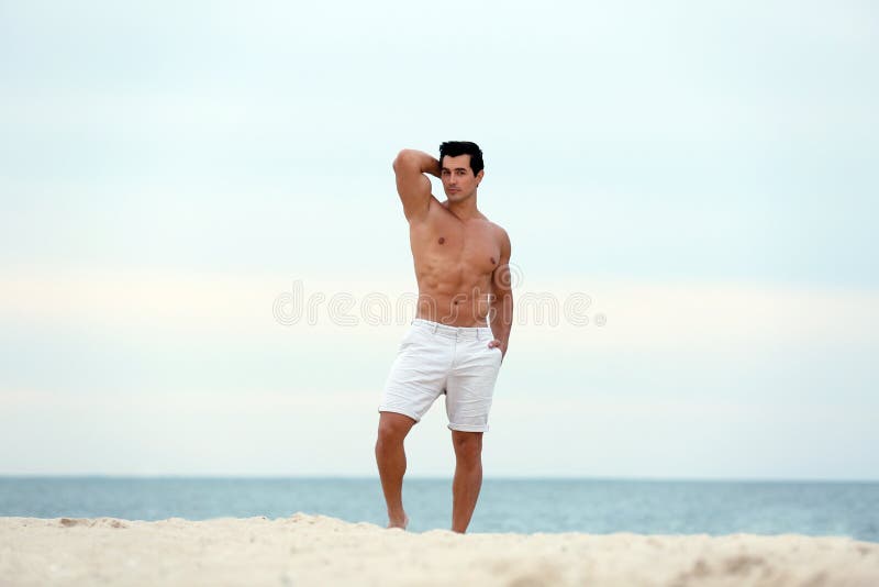 Handsome Young Man Posing on Beach Near Stock Image - Image of person ...