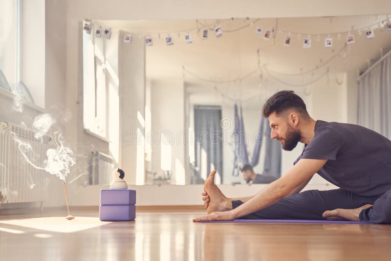 Handsome Young Man Practicing Yoga and Using Wireless Robot Camera ...