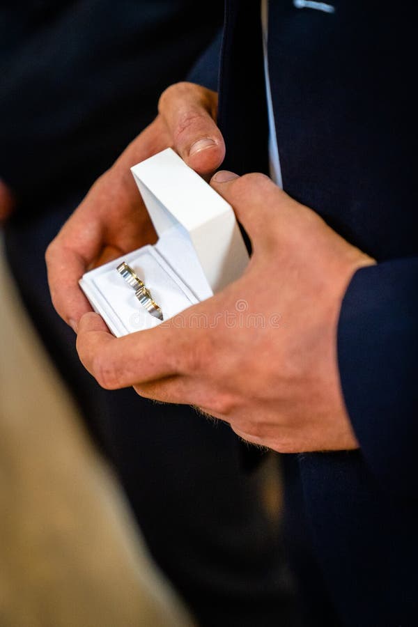 Handsome Young Man Presenting Something in a Small Box, Wedding Rings ...