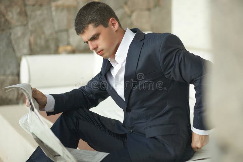 Handsome Young Man Reading Morning Newspaper in Black Suit. Stock Photo ...