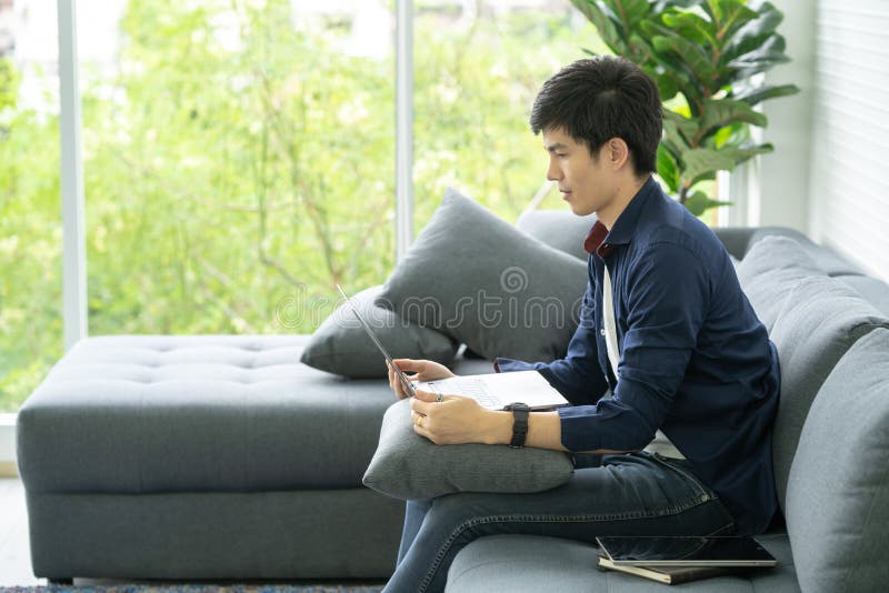 Handsome Young Man Reads the Screen of a Laptop Computer Stock Image ...