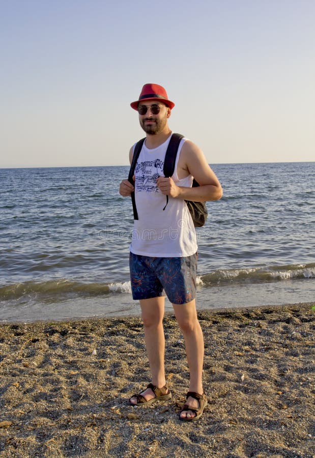 Young Man in Red Hat on the Beach Stock Image - Image of leisure, water ...