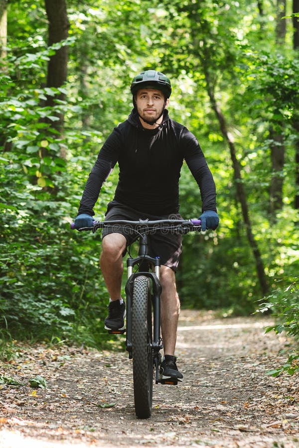 Handsome Man Riding Bike Down the Forest Trail Stock Image - Image of ...