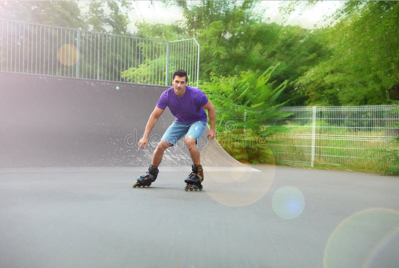 Handsome Young Man Roller Skating Stock Image - Image of park, inline ...