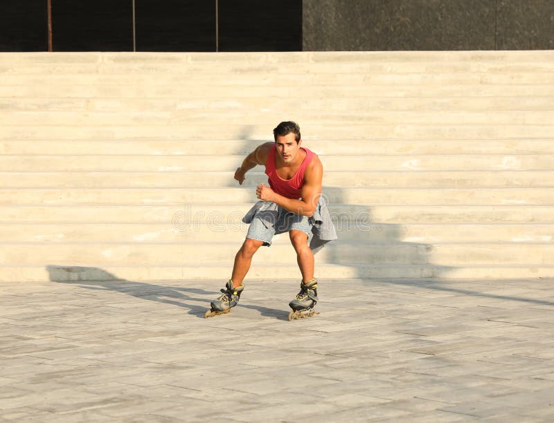 Handsome Young Man Roller Skating on Street Stock Photo - Image of ...