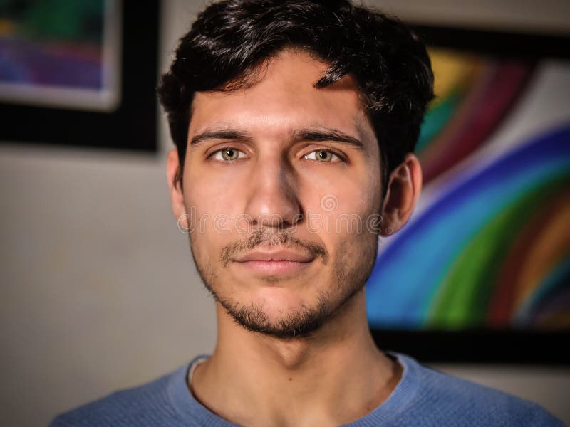 Handsome Young Man with Serious Expression at Home Stock Photo - Image ...