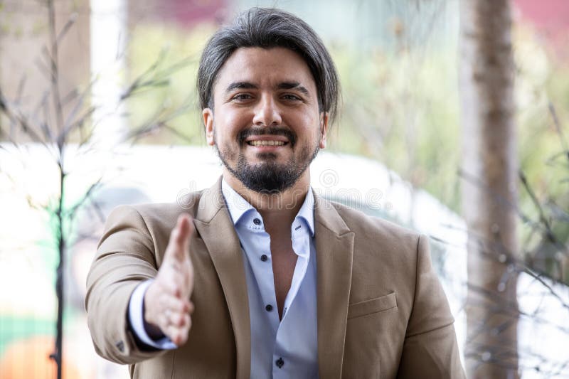 Handsome Young Man Shaking Hand into the Camera Stock Image - Image of ...